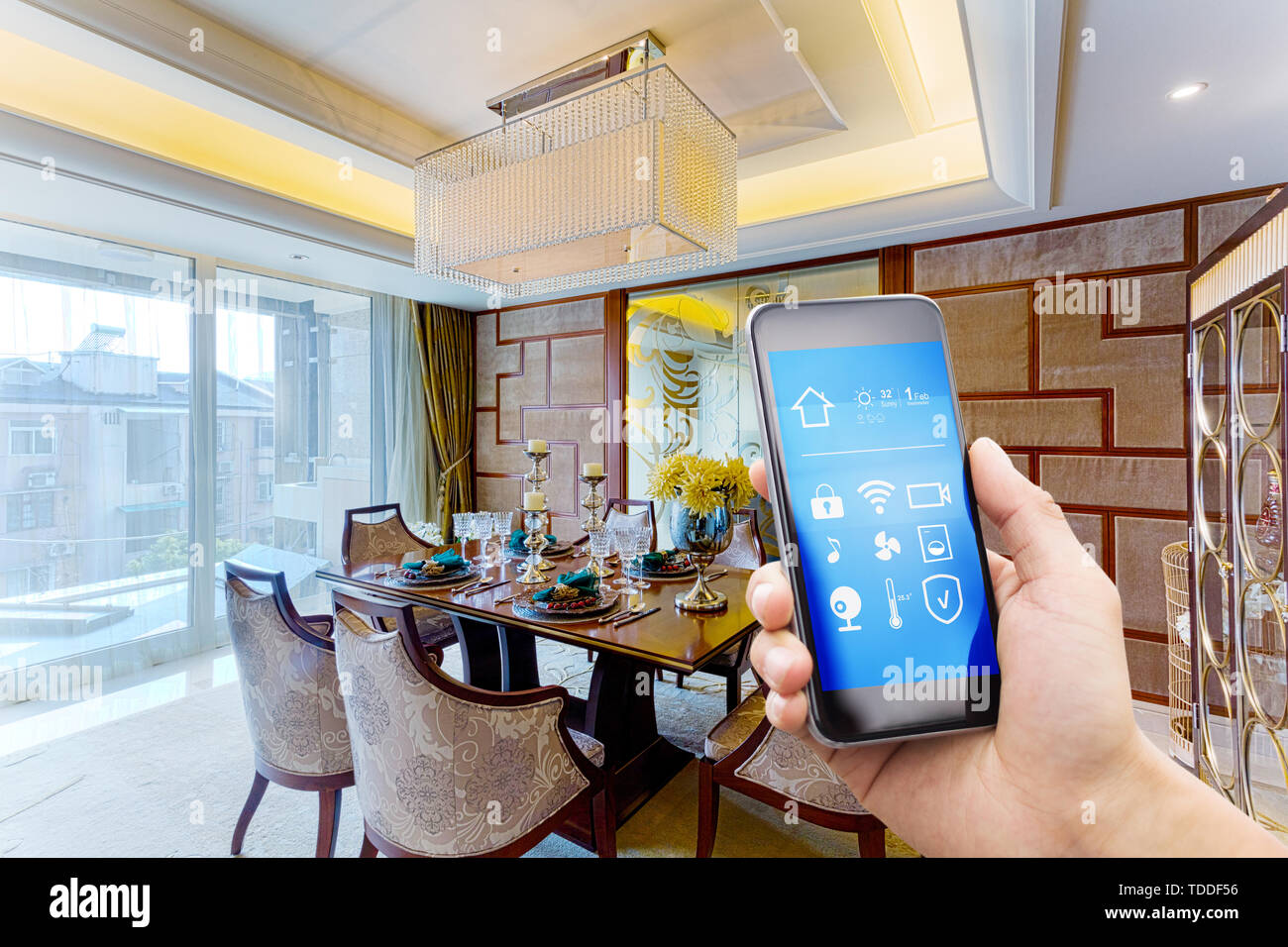 smart phone with smart home with modern dining room Stock Photo - Alamy