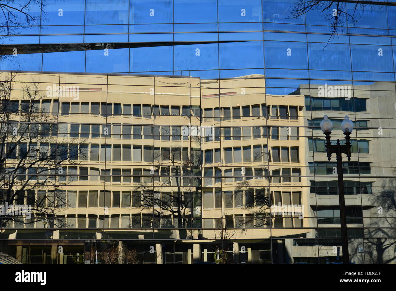 Architectural projection on the glass curtain wall Stock Photo - Alamy