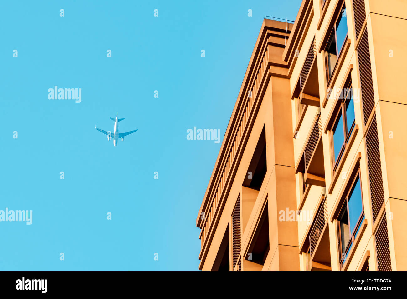 A plane flew over the top of the building Stock Photo - Alamy