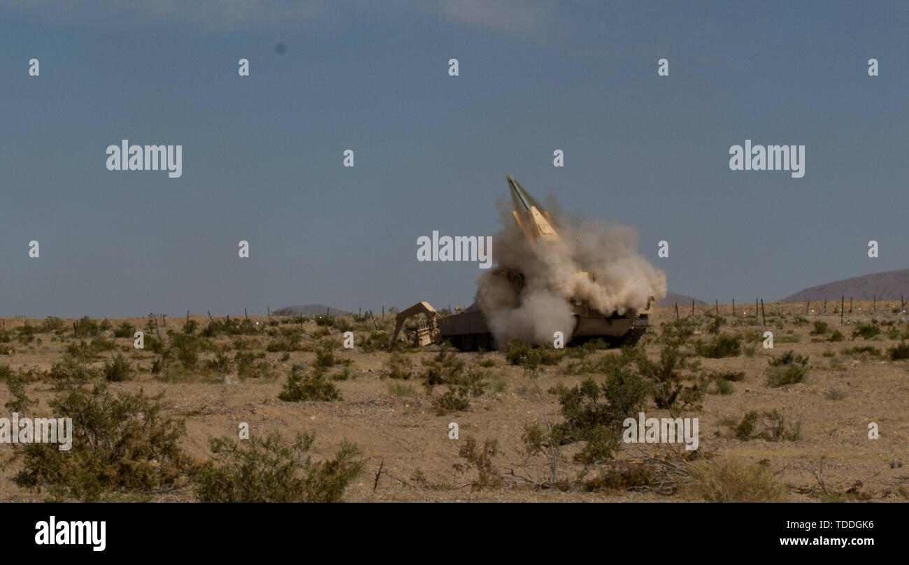 An M1150 Assault Breacher Vehicle that launches a mine clearing line ...
