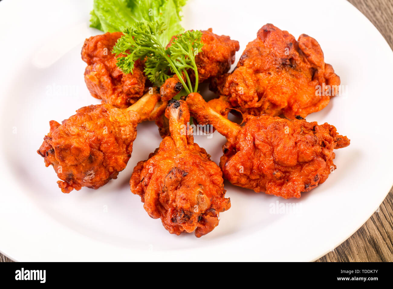 Indian traditional cuisine - Chicken lollipops with spices Stock Photo ...