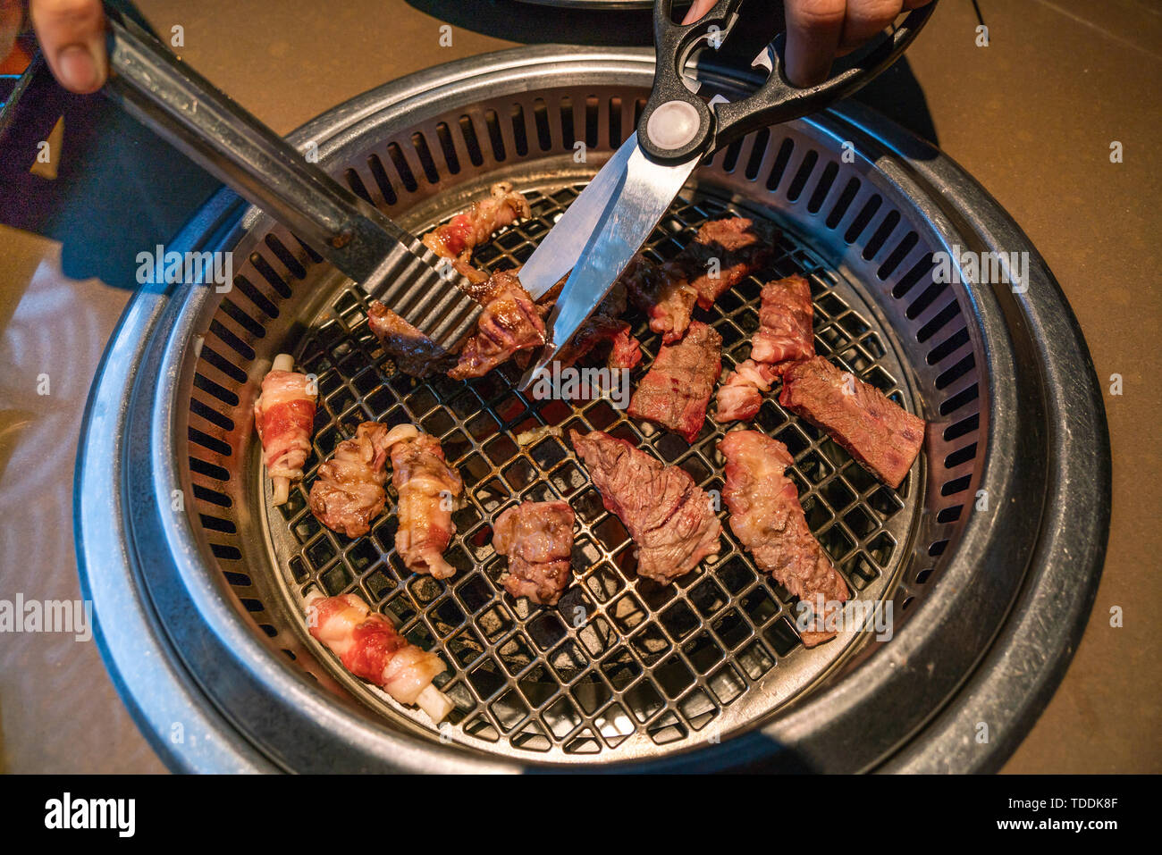 Grilled meat on coal stove Japanese style barbecue yakiniku Stock Photo ...