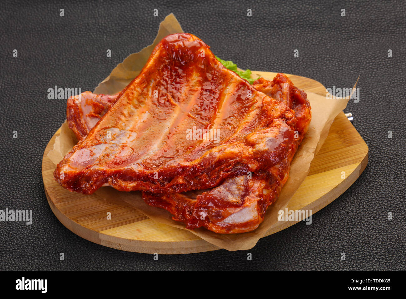 Raw marinated pork ribs ready for cooking Stock Photo - Alamy