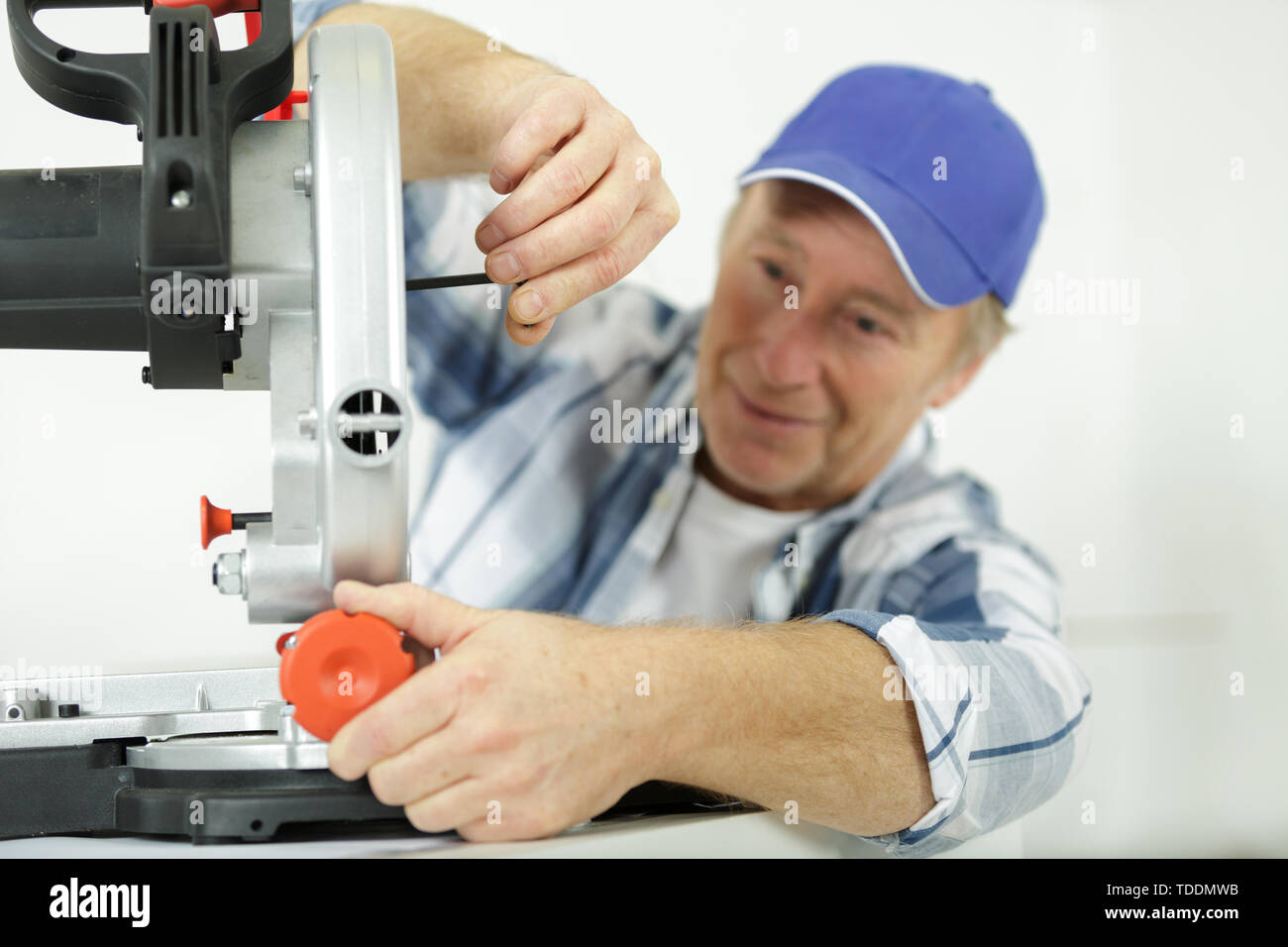 Senior man holding saw hi-res stock photography and images - Alamy