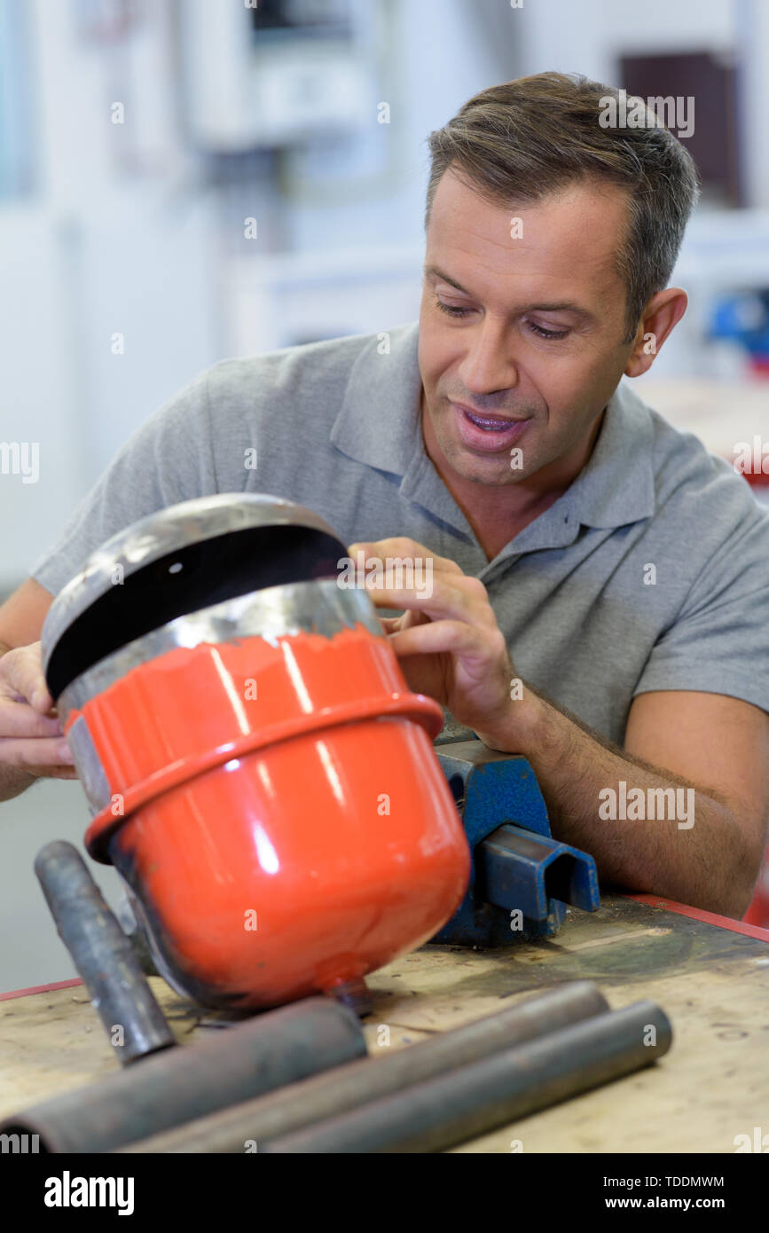 man fixing a machine Stock Photo - Alamy