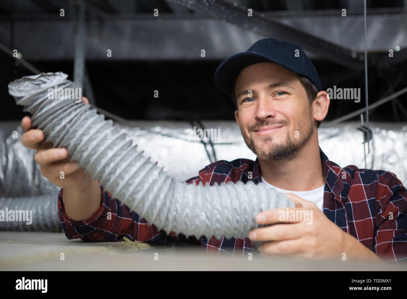 hvac technician ready to install ventilation system in house Stock ...