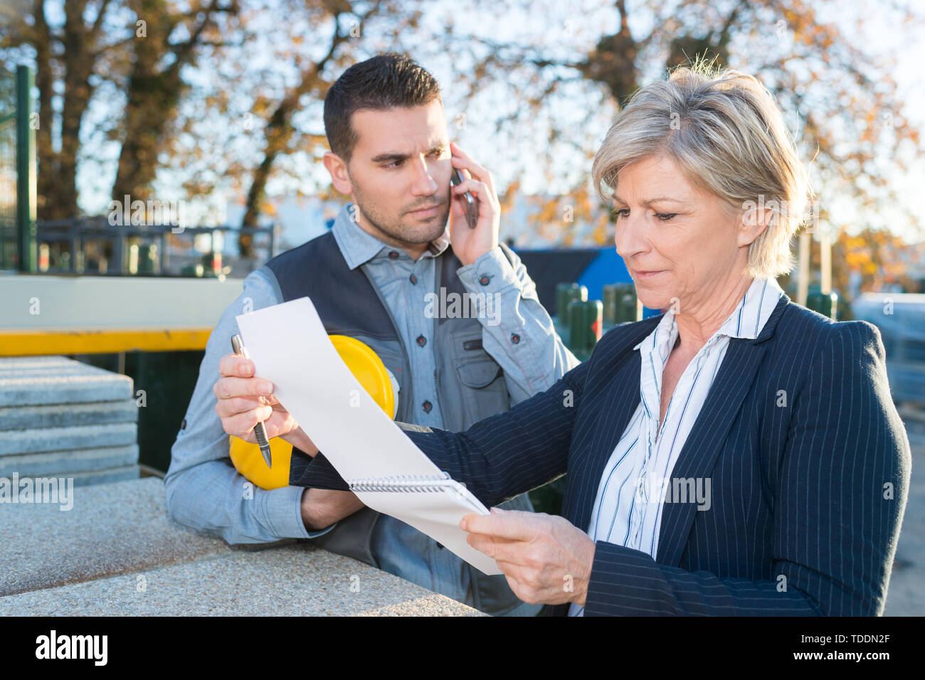 engineers and architect working outside a construction site Stock Photo ...
