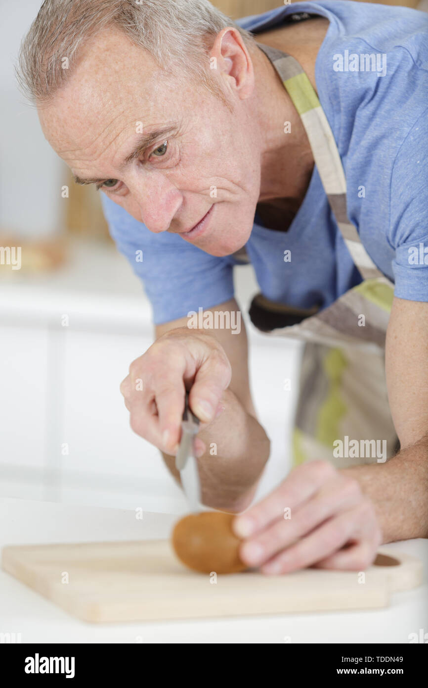 Hands using kitchen knife cutting hi-res stock photography and images ...