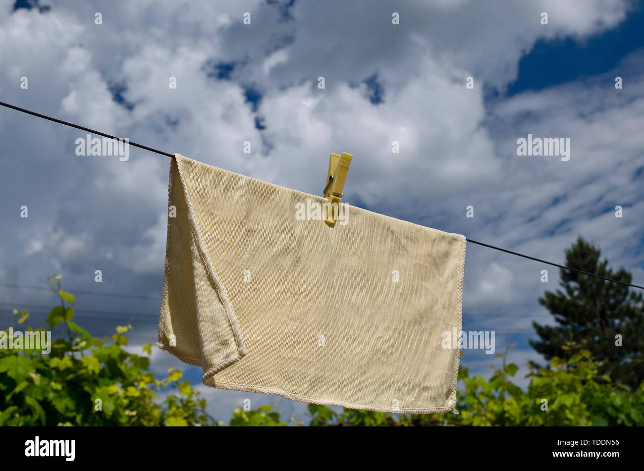 Clothes peg on a blue towel and washing line against a blue sky Stock ...