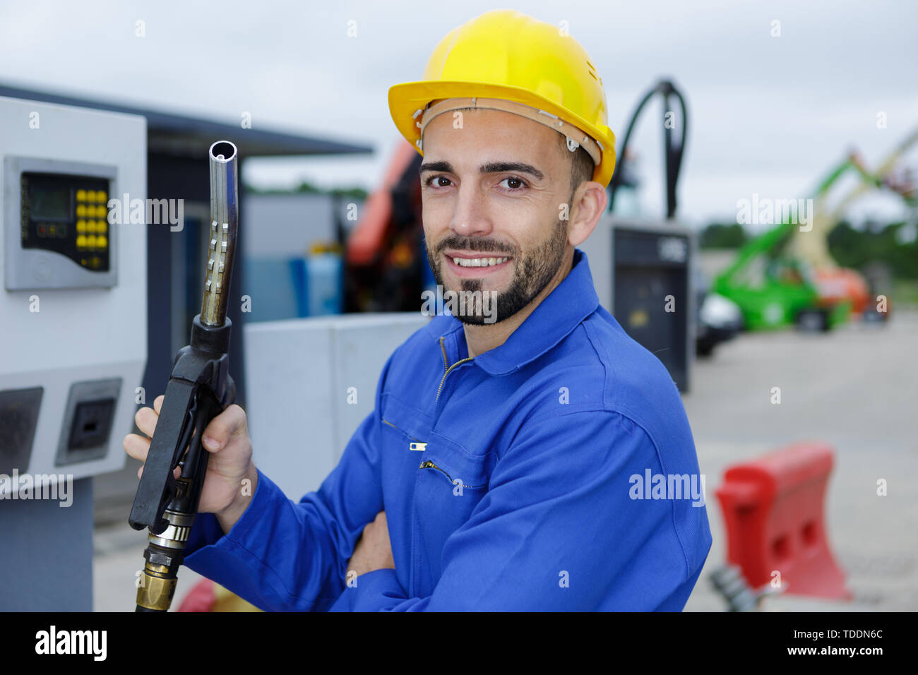 man engineer doing some petrol Stock Photo - Alamy