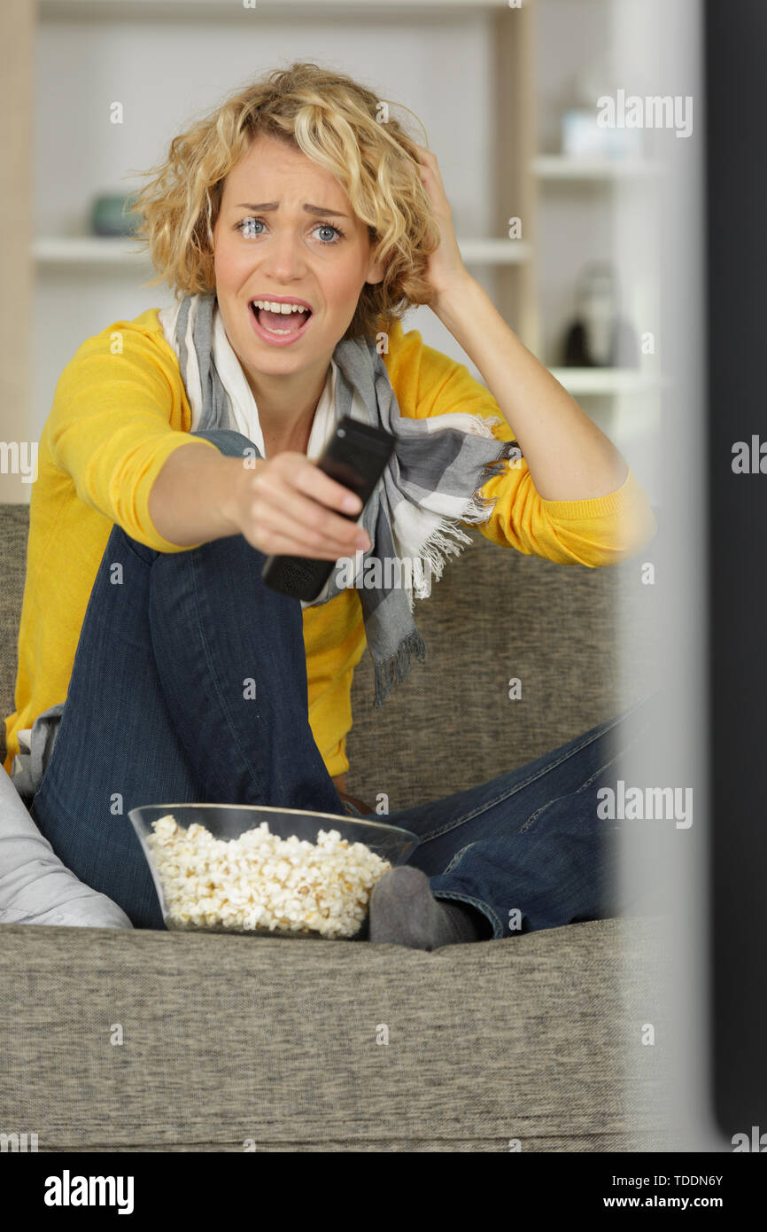 emotional lovely girl shouting at tv Stock Photo - Alamy