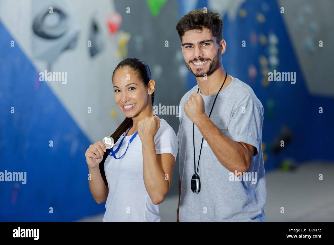 successful wall climbing team posing with medal Stock Photo - Alamy