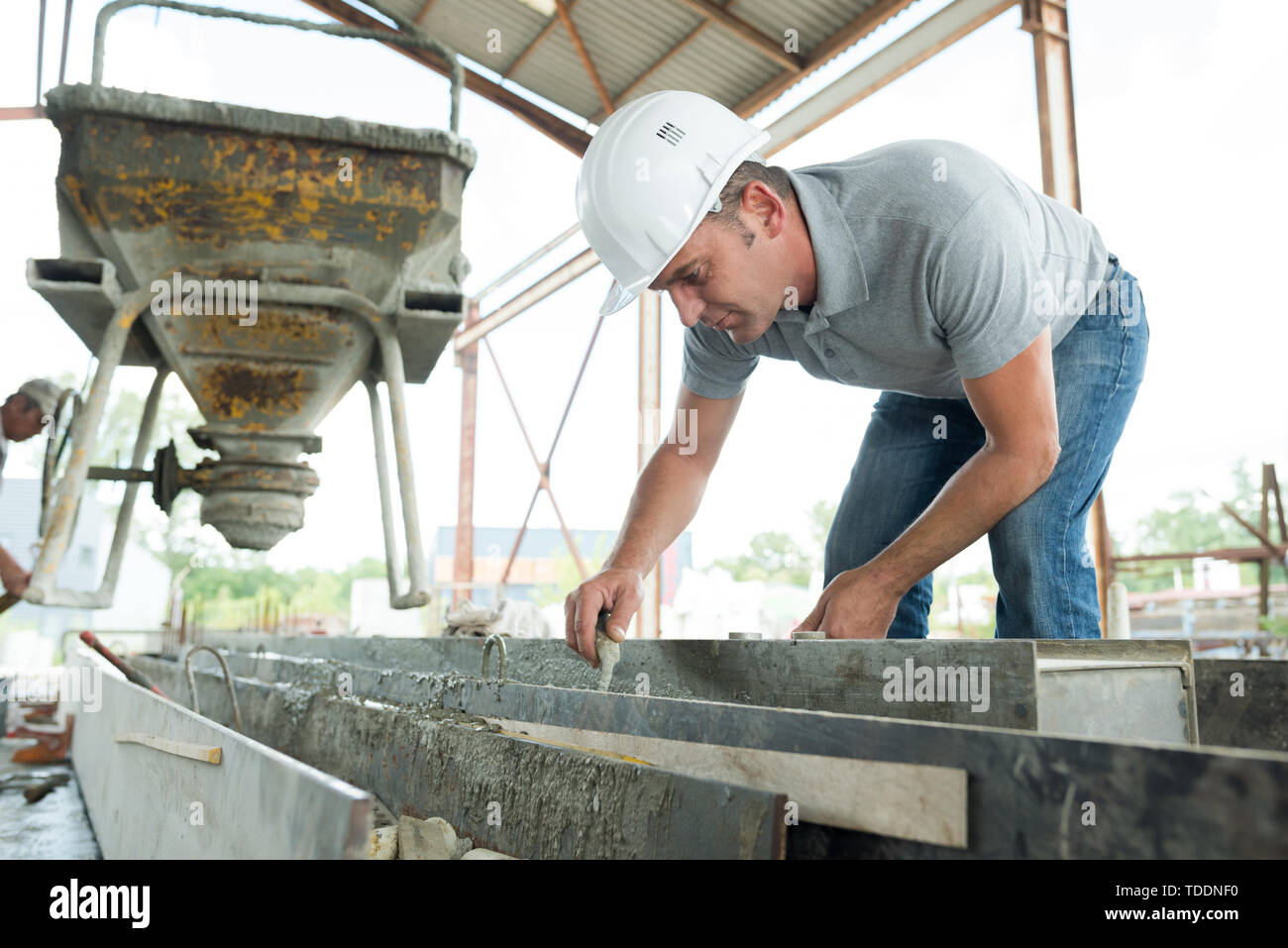 construction worker with cement in the cement trolley Stock Photo - Alamy