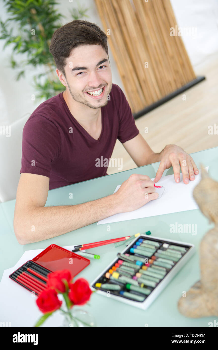 man drawing at home Stock Photo - Alamy