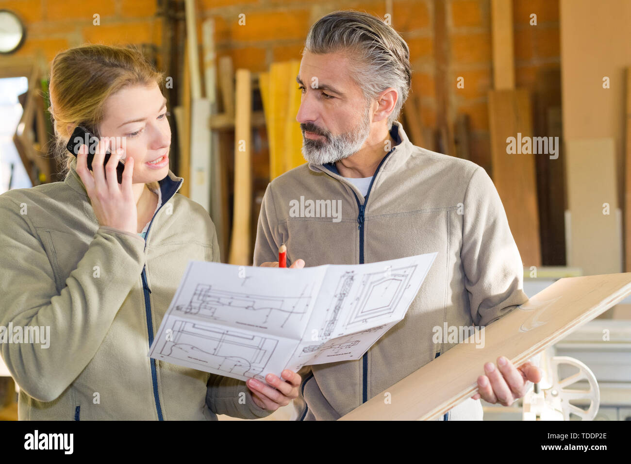 couple talking about interior design Stock Photo - Alamy
