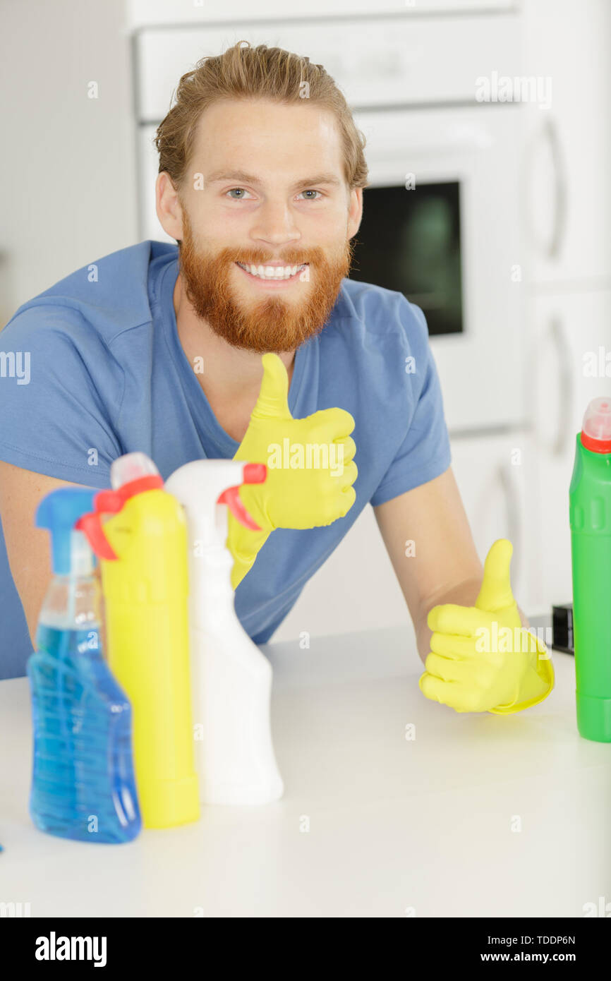 young housekeeper man showing thumbs up Stock Photo - Alamy