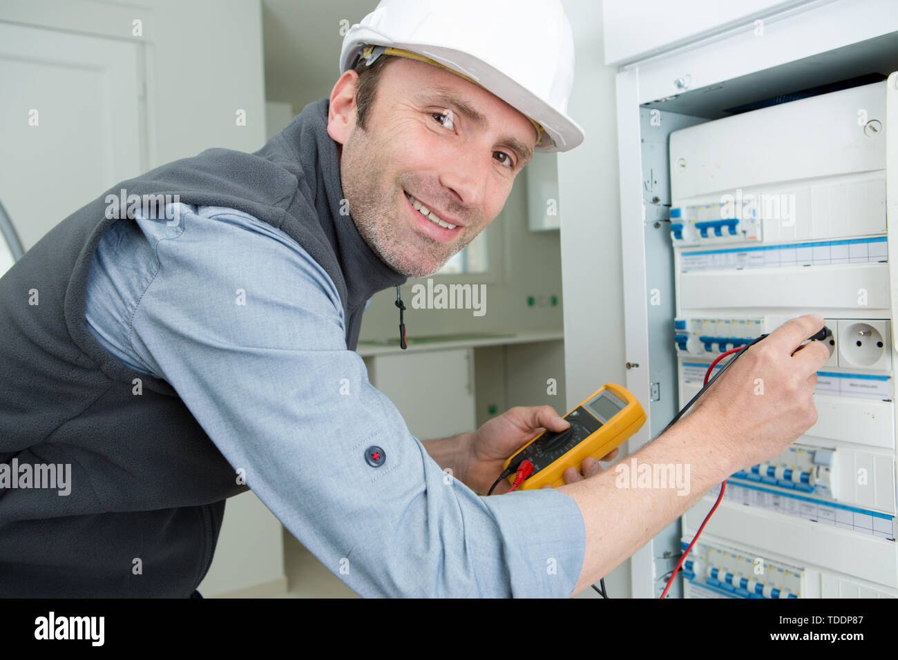 man measuring voltage Stock Photo - Alamy