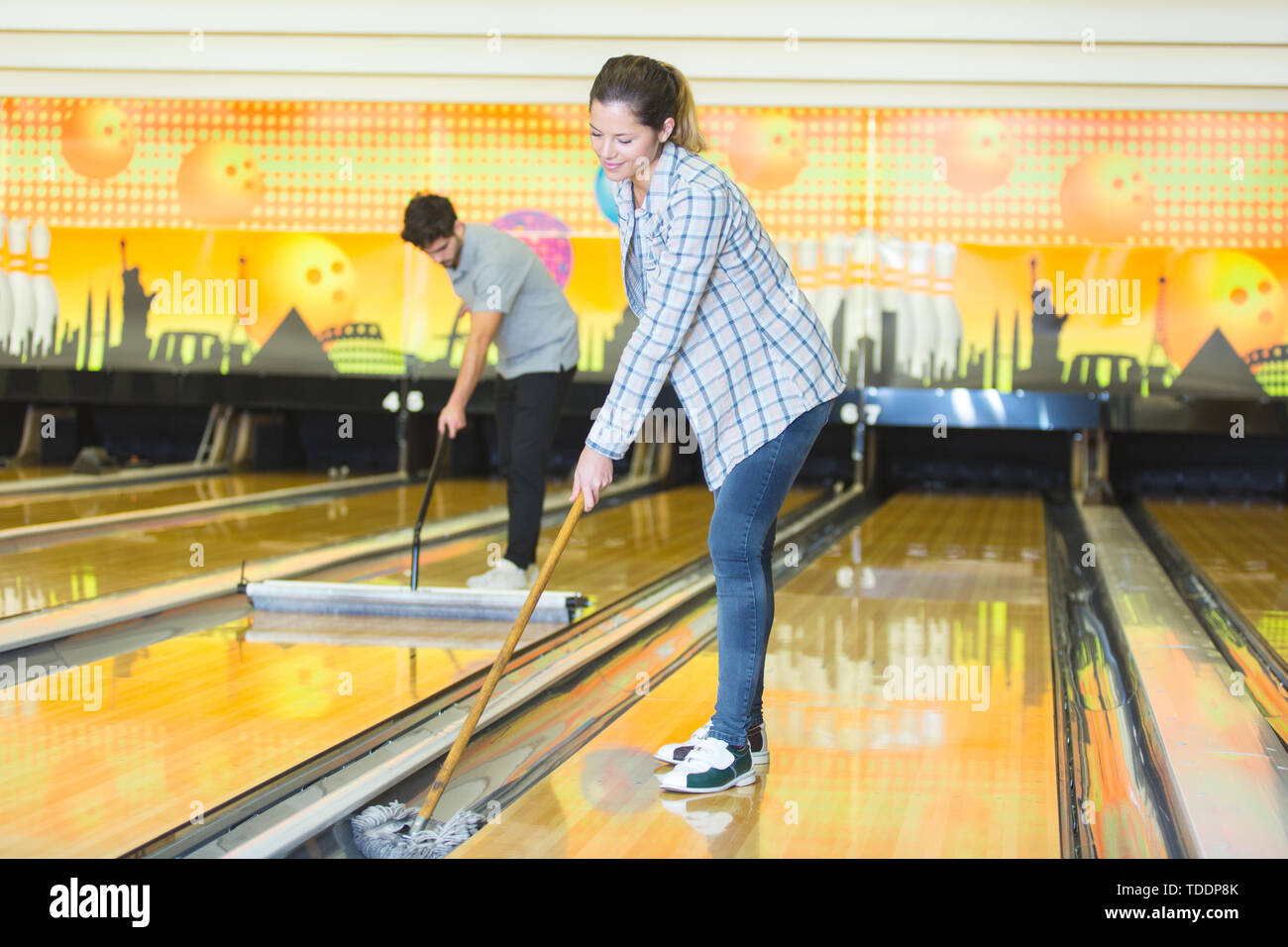 staffs mopping the bowling lane Stock Photo - Alamy
