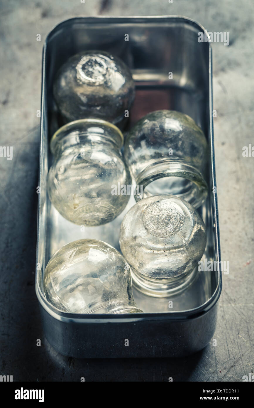 Old medical cupping glass in a metal steel container Stock Photo - Alamy