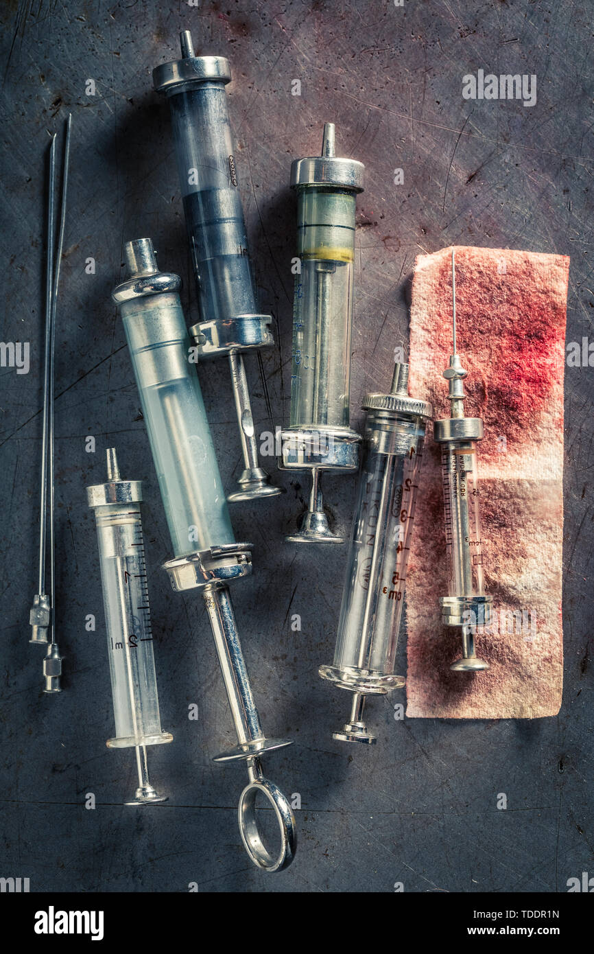 Old needle and syringes prepared on metal table Stock Photo - Alamy