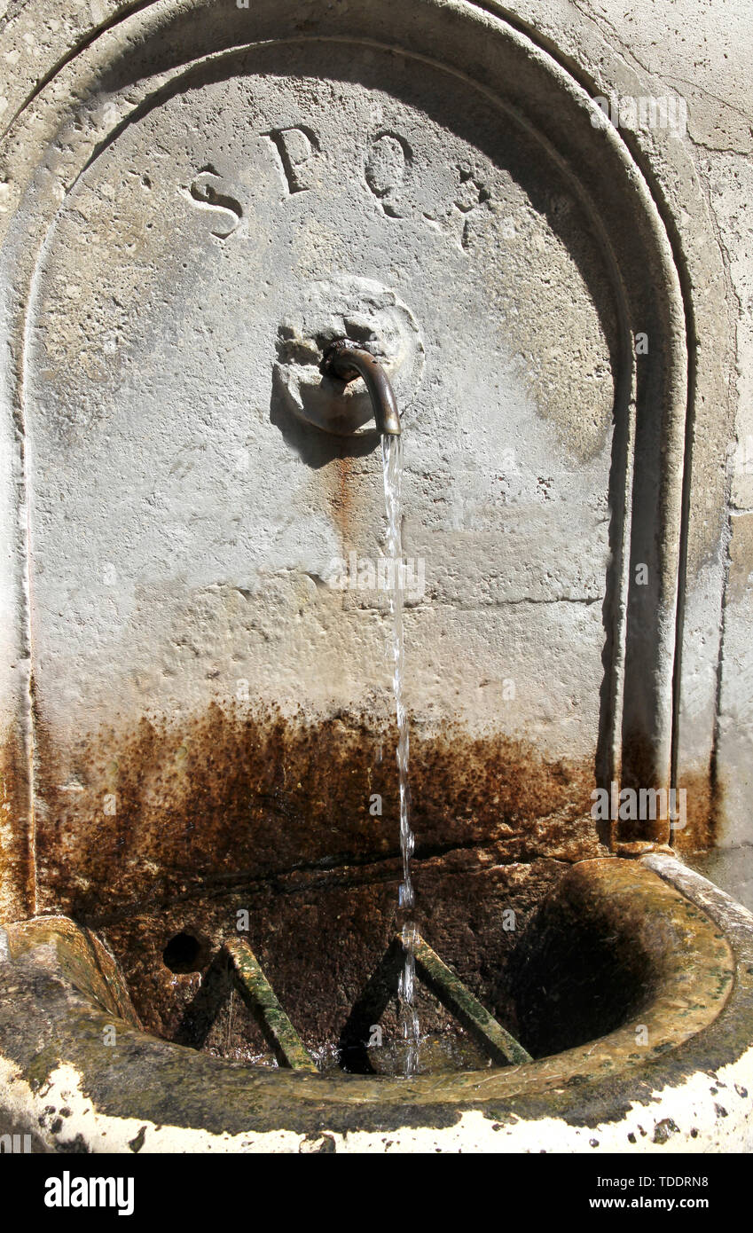Ancient Roman Fountain with text SPQR that means Roman Senate and Roman ...