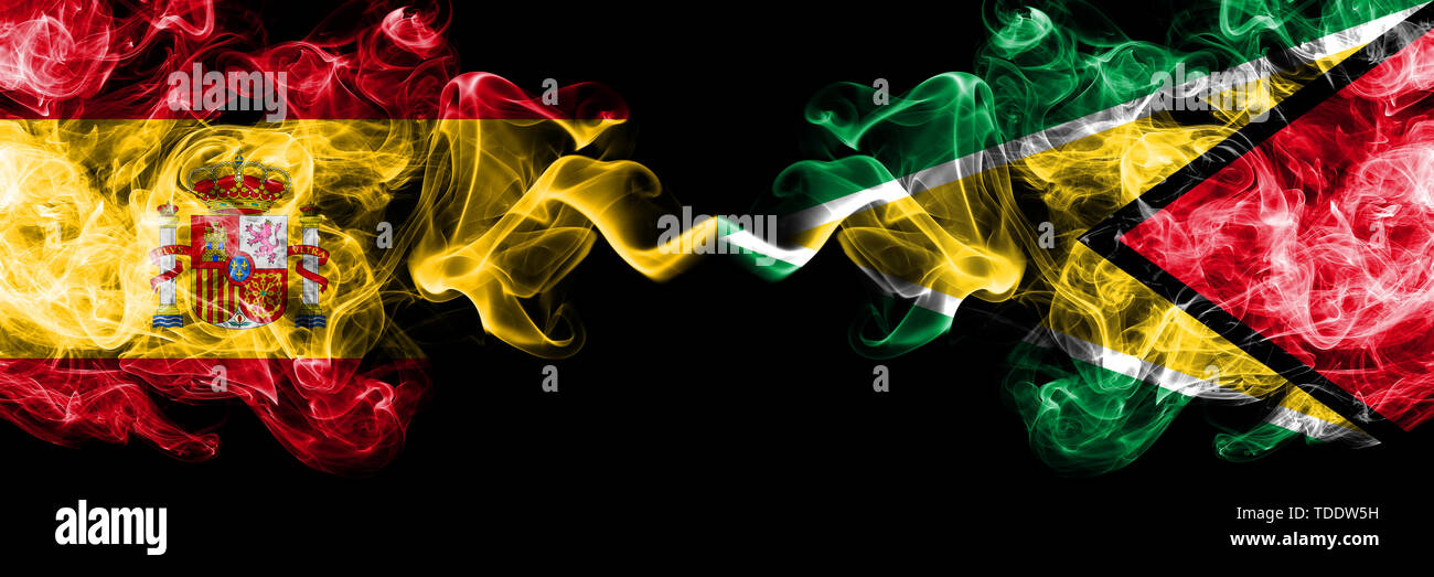 Spain vs Guyana, Guyanese smoky mystic flags placed side by side. Thick ...