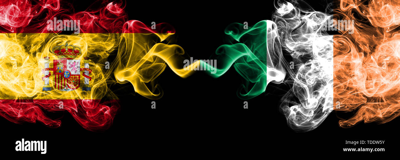 Spain vs Ireland, Irish smoky mystic flags placed side by side. Thick ...
