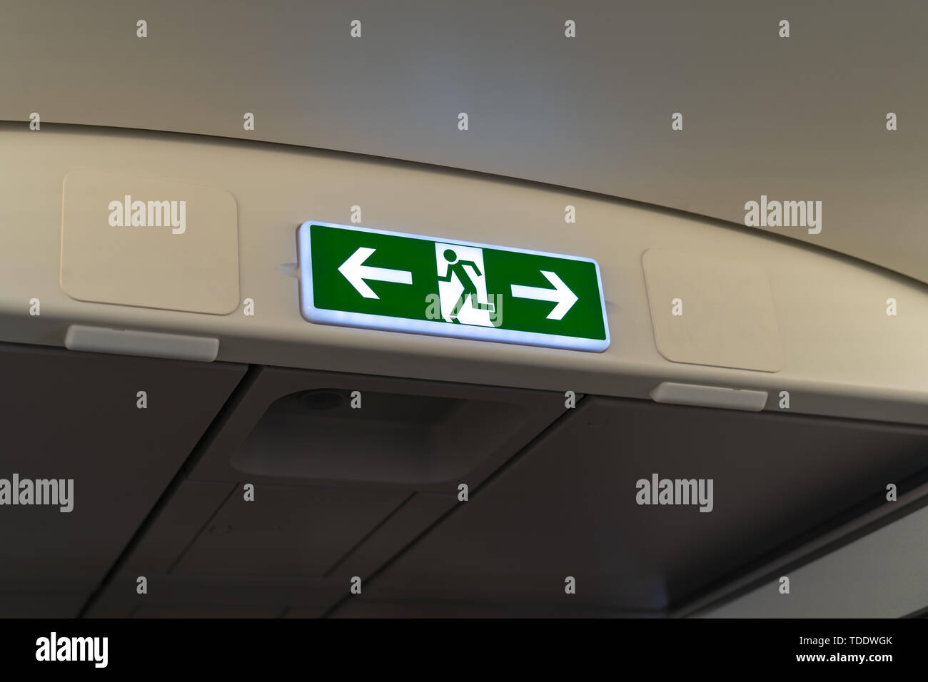 Exit lightbox signage on airplane, escape way of life. way to survive ...