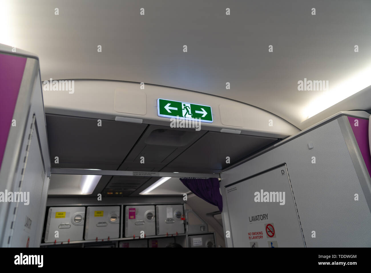 Exit lightbox signage on airplane, escape way of life. way to survive ...