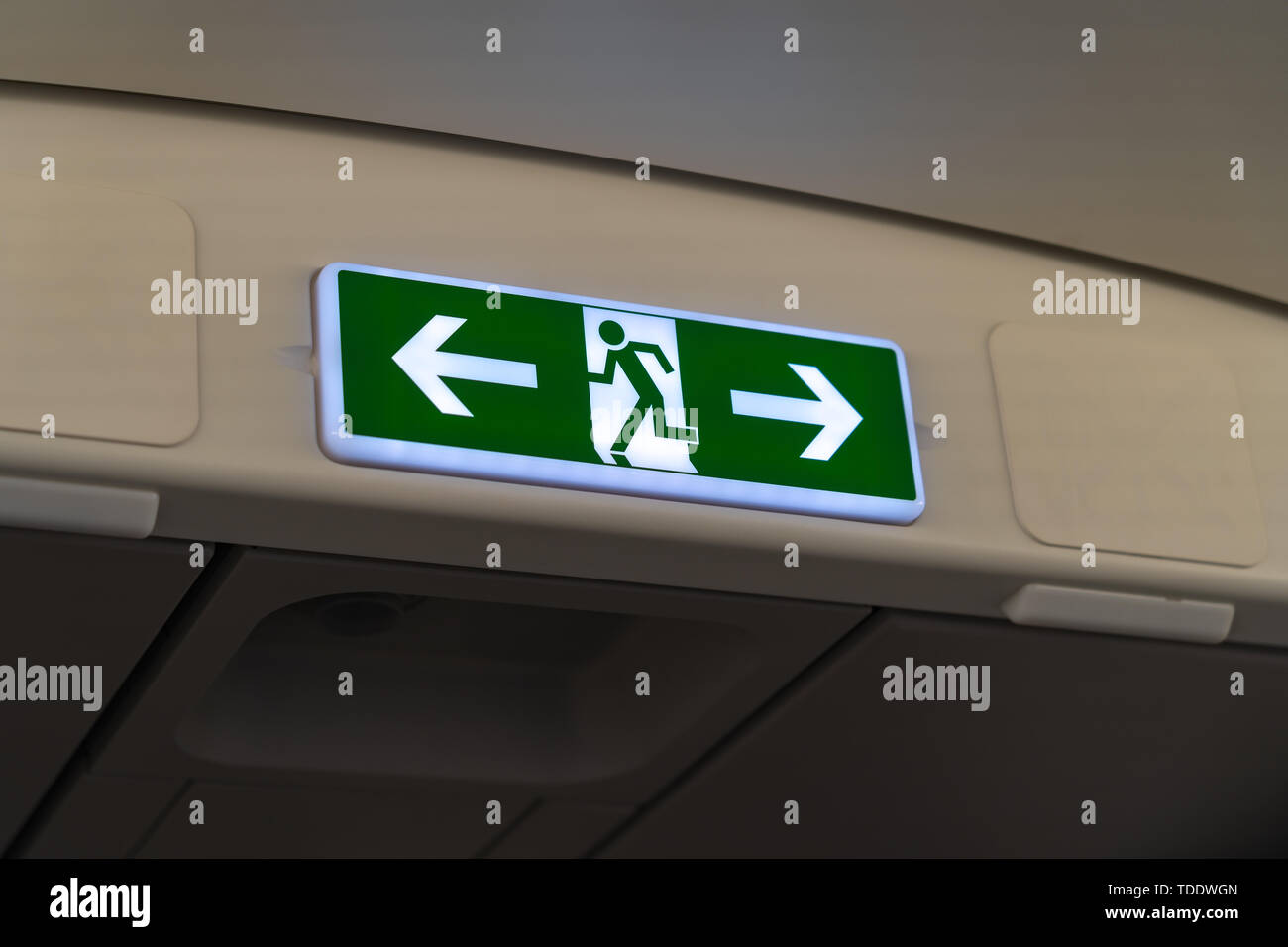 Exit lightbox signage on airplane, escape way of life. way to survive ...