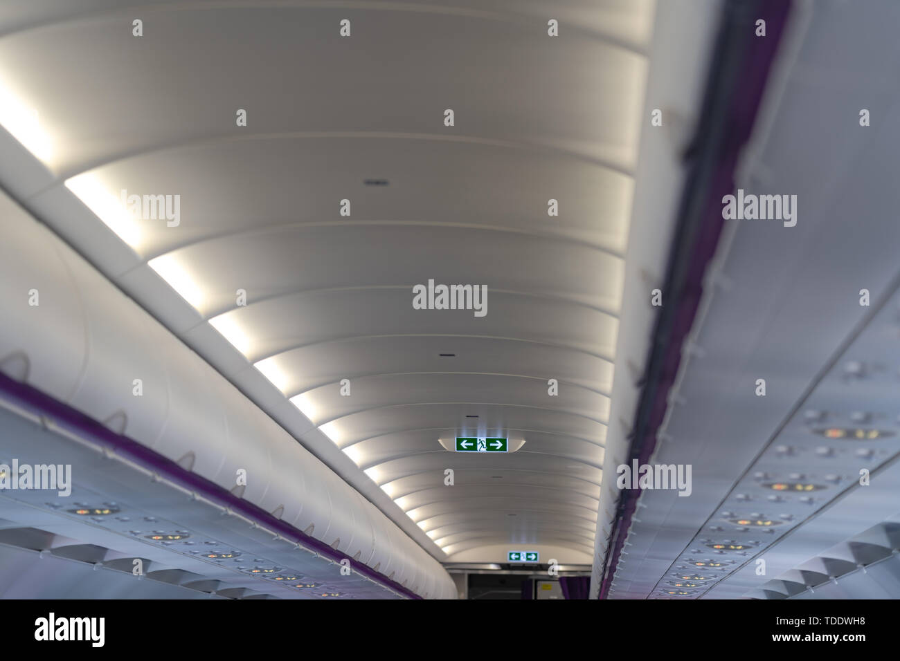 Airplane cabin interior exit sign hi-res stock photography and images ...