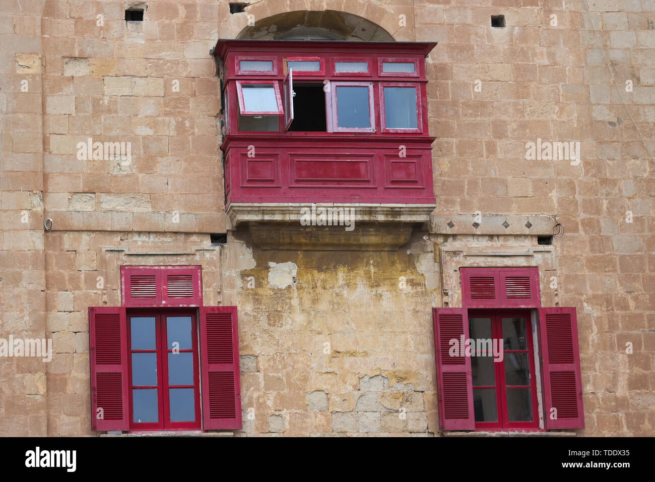 Typical Maltese covered red balcony and windows in Valletta Stock Photo ...