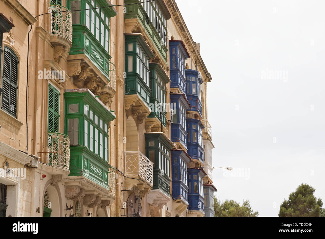 Typical Maltese covered green and blue balcony and windows Stock Photo ...