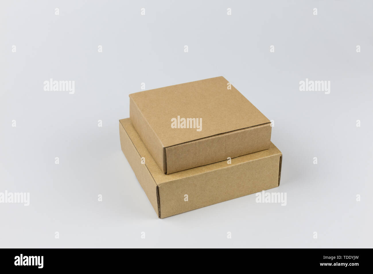 isolated yellow paper box on white background Stock Photo - Alamy