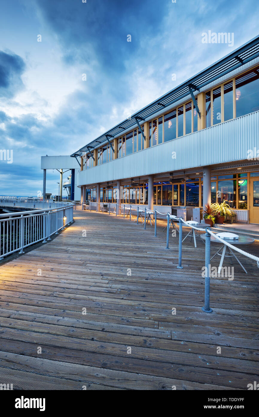 cloudy sky and empty wooden footpath front architectue at twilig Stock ...