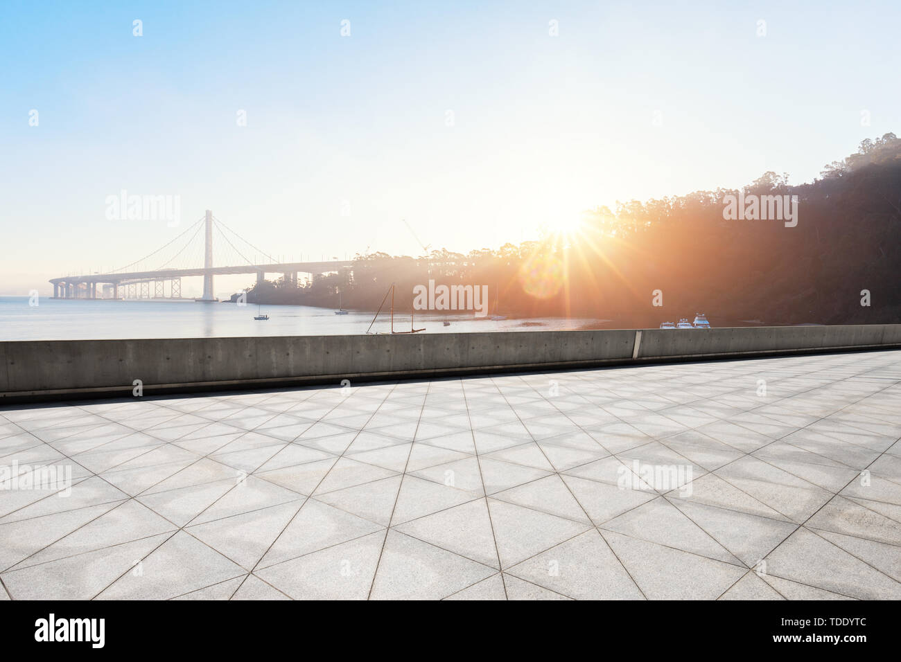 empty floor near modern suspension bridge with sunbeam Stock Photo - Alamy