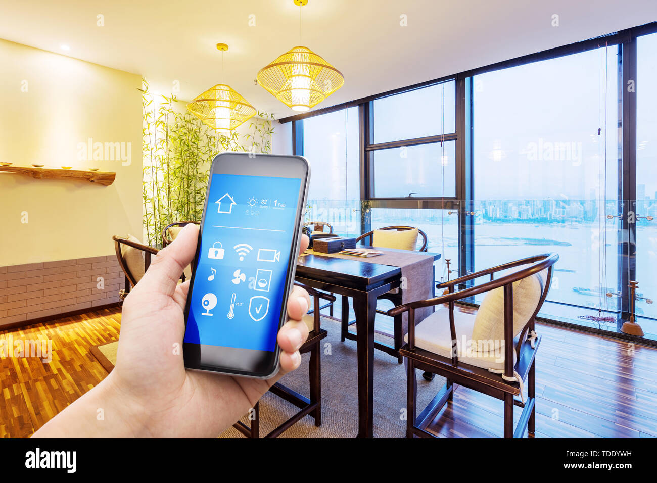smart phone with smart home with modern dining room Stock Photo - Alamy