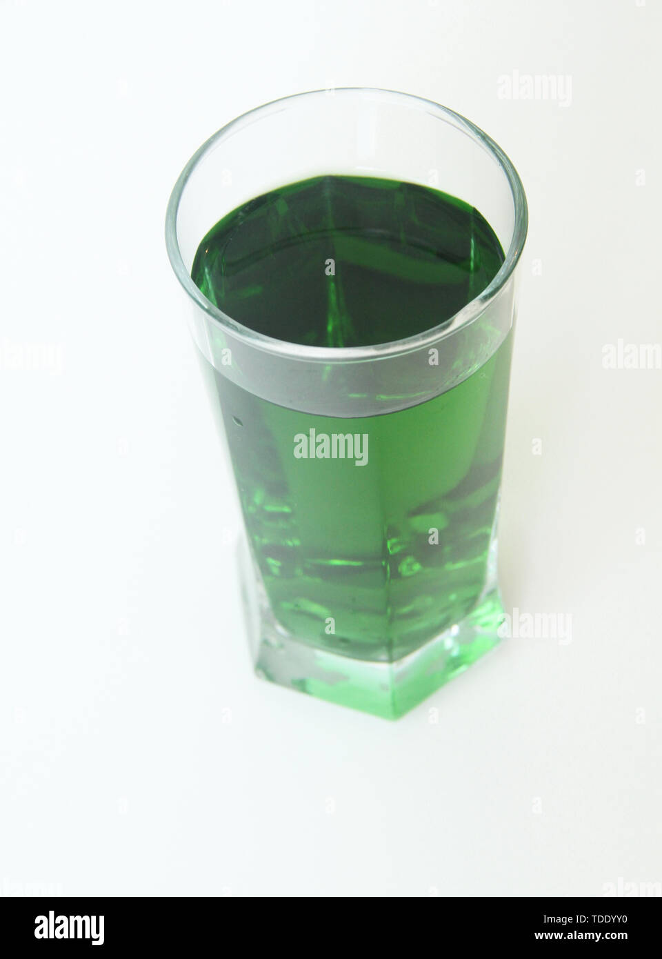 Glass of green liquid on white background, São Paulo, Brazil Stock ...
