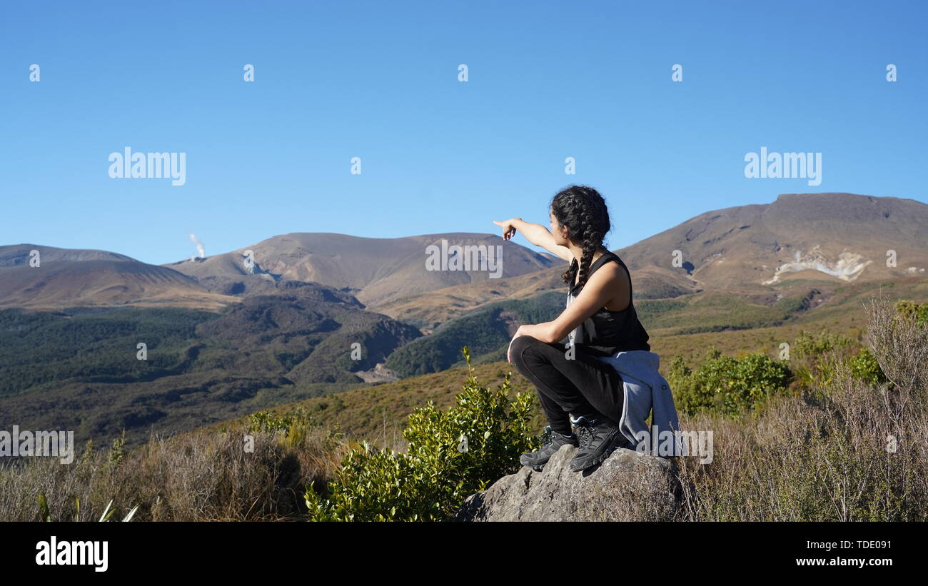 Girl pointing a direction Stock Photo - Alamy