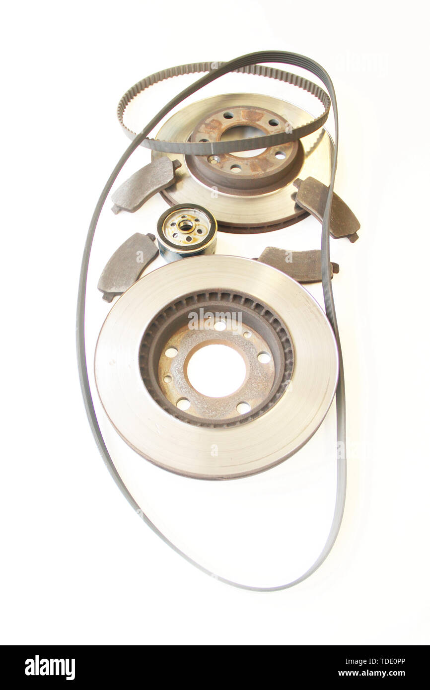 Pair old car brake disc, pads, oil filter and belt isolated on white ...