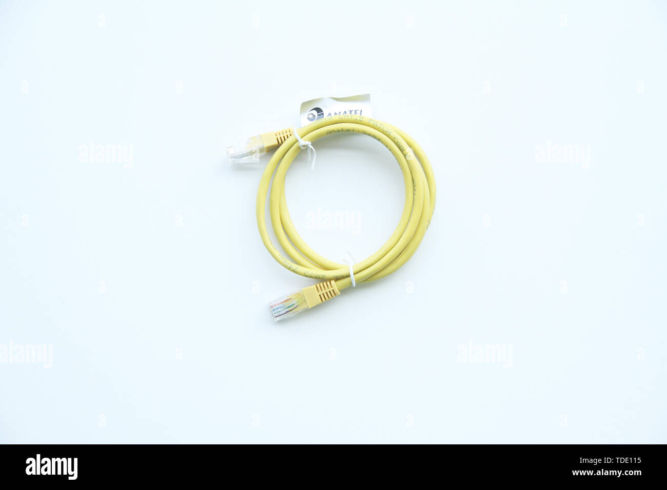 Yellow rolled-up patch cable, used to connect a computer to an internal ...