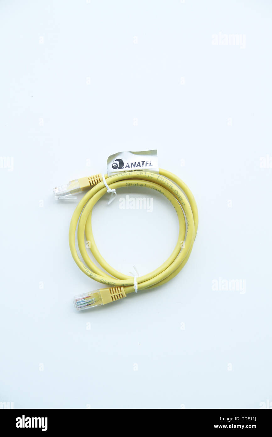 Yellow rolled-up patch cable, used to connect a computer to an internal ...