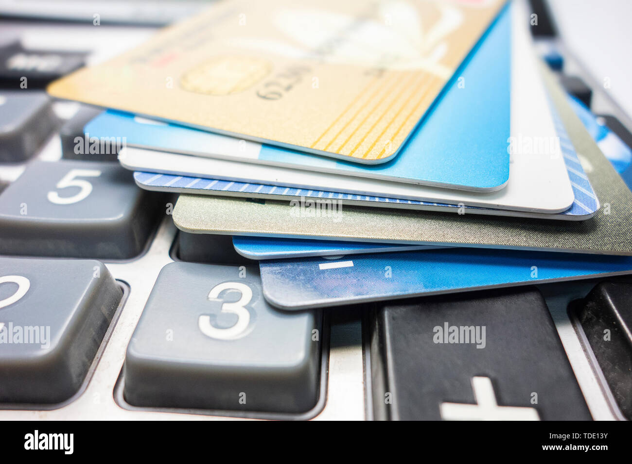 Multiple bank cards and calculators Stock Photo - Alamy