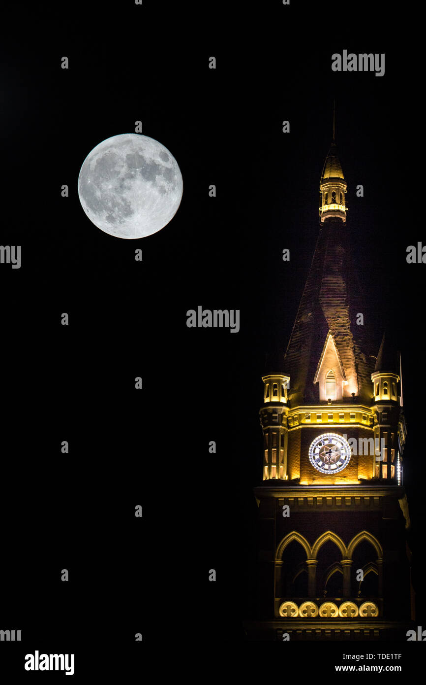 Clock tower full moon Stock Photo - Alamy