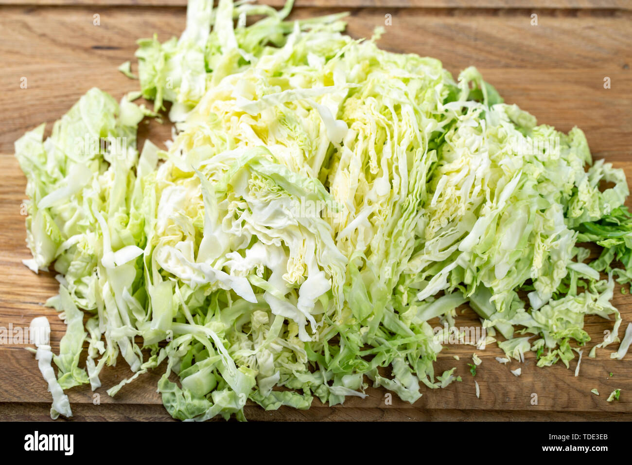 Chopped savoy cabbage on a wooden board. Healthy food Stock Photo - Alamy