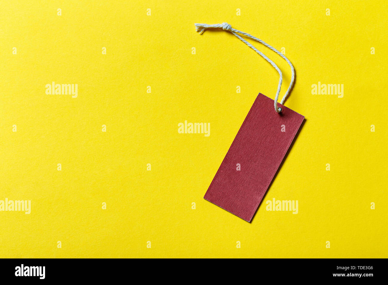 Red blank paper price tag or label on yellow background. Top view Stock ...