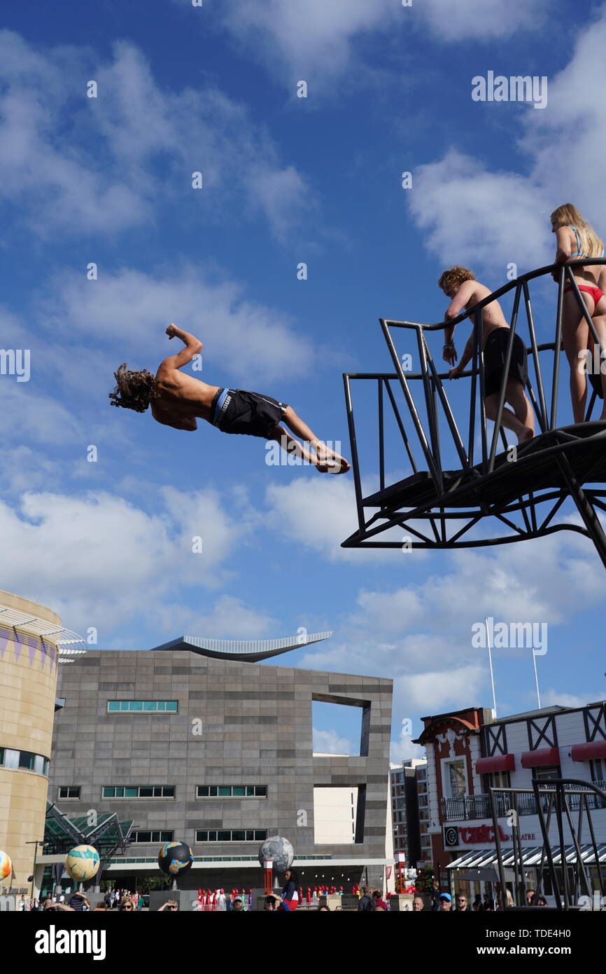 Boy jumping from platform in wellington Stock Photo - Alamy