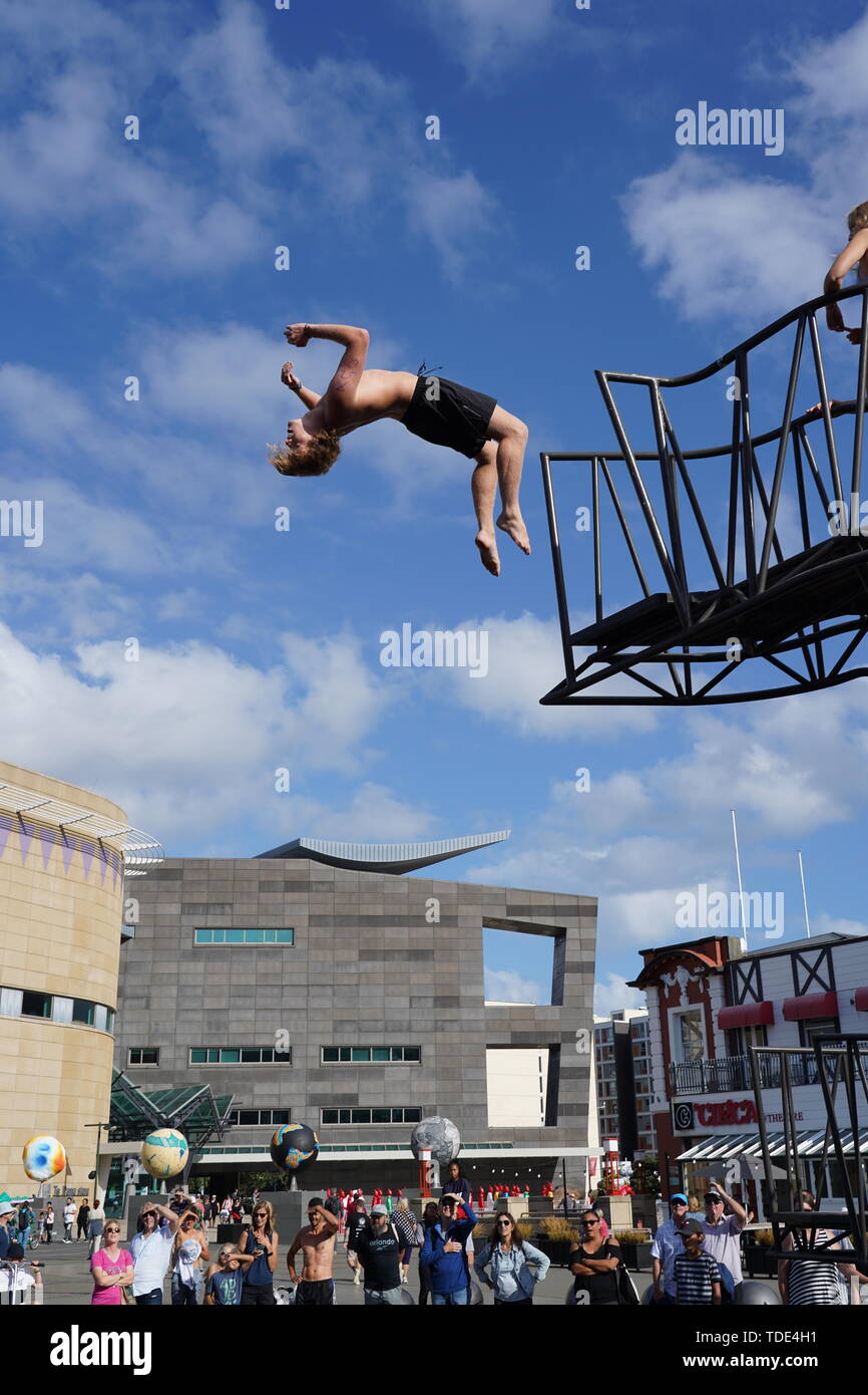 Boy jumping from platform in wellington Stock Photo - Alamy