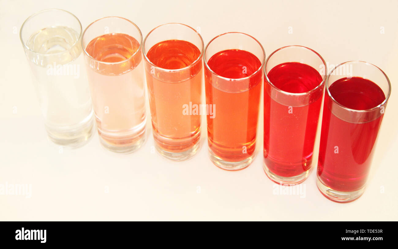 Five glasses of red liquid on white background, São Paulo, Brazil Stock ...