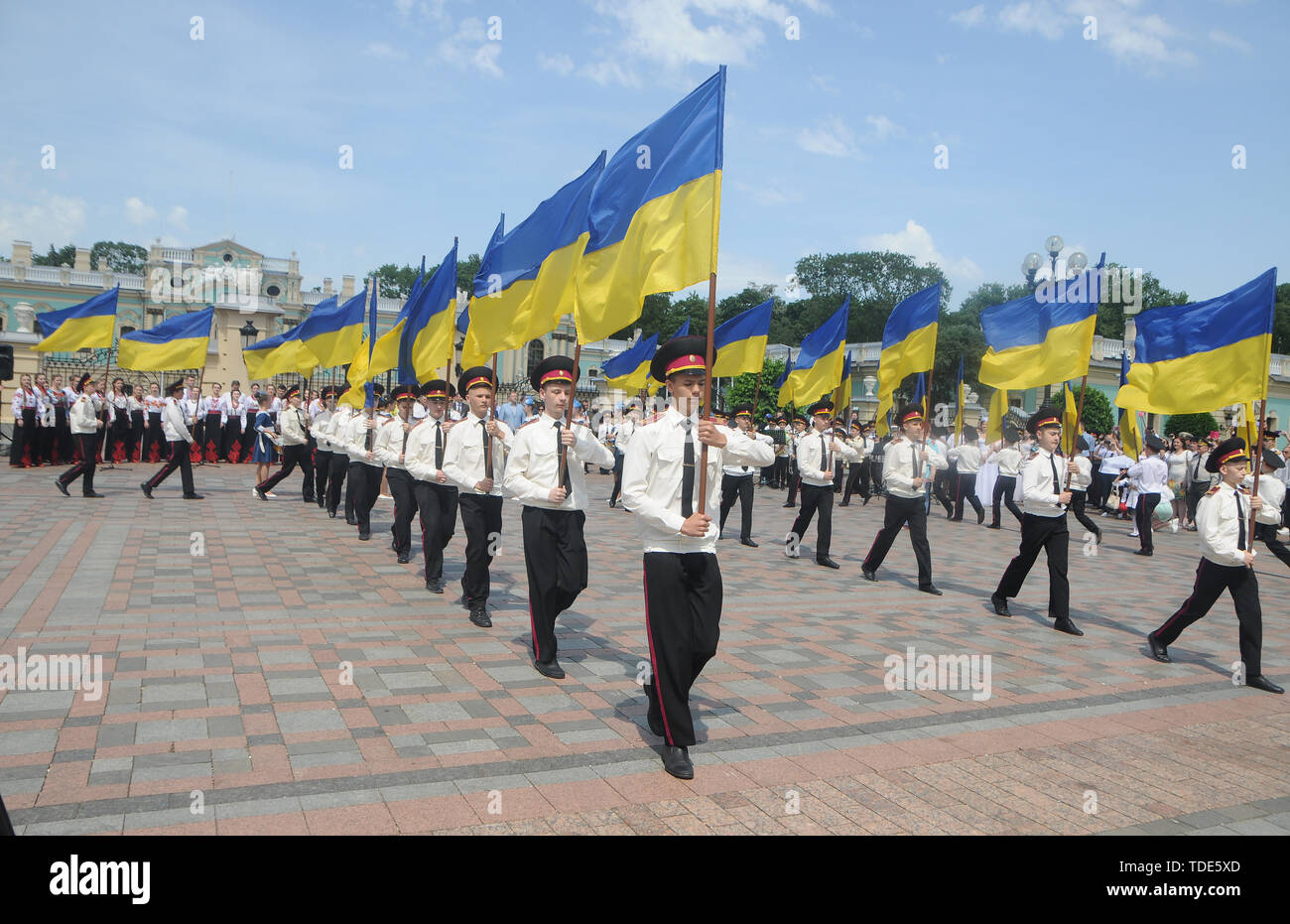The cadets march with Ukrainian flags during the ceremony. Holiday ...